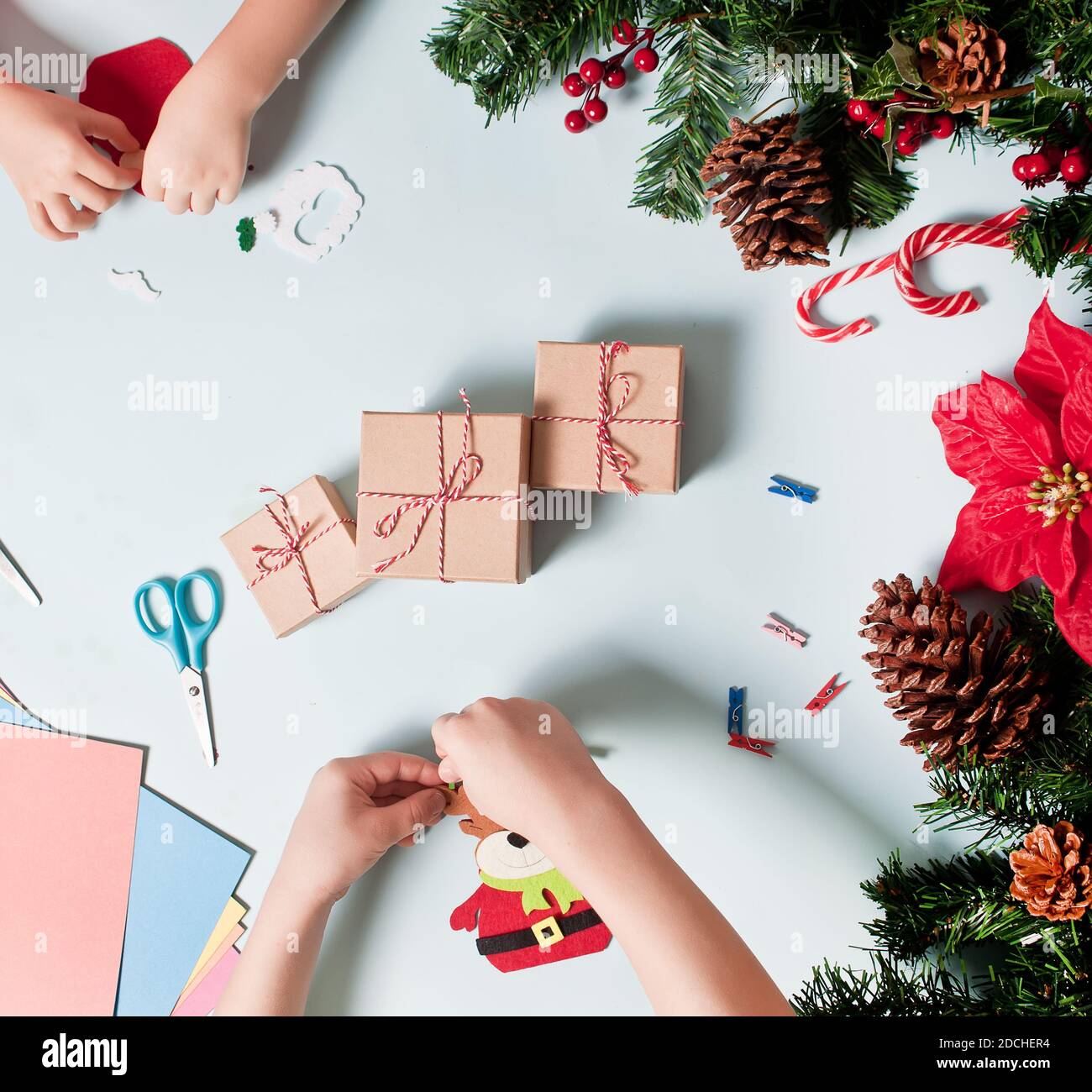 Kids making decor for Christmas tree or gifts. Christmas handmade diy ...