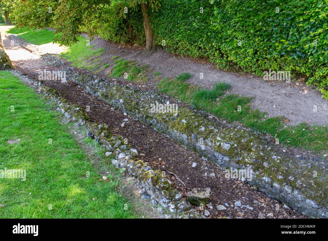 Drainage ditch around the edge of the remains of Thetford Priory, a ...