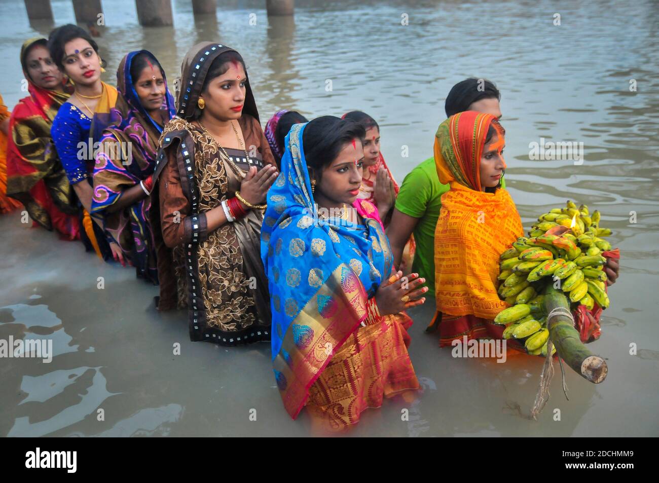 The horizon community devotees observe the rituals of the Chhath Puja ...