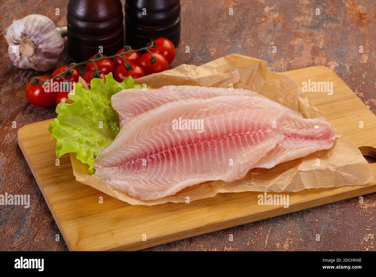 Raw tilapia fish ready for cooking Stock Photo - Alamy