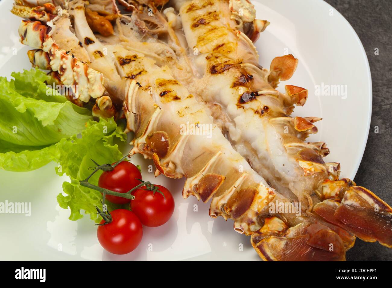 Grilled crayfish in the plate served salad Stock Photo - Alamy