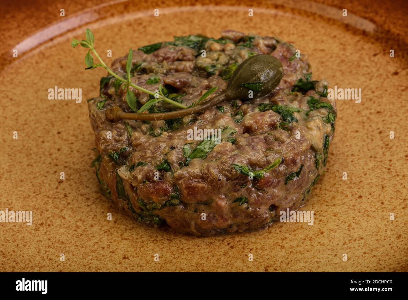 Raw beef tartar snack with capers Stock Photo - Alamy