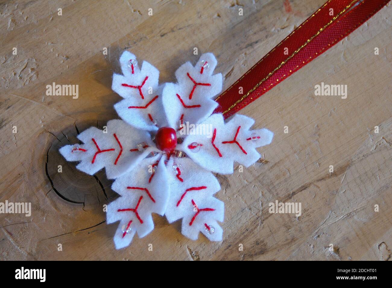 Snowflake, felt Christmas decoration, handmade Stock Photo - Alamy