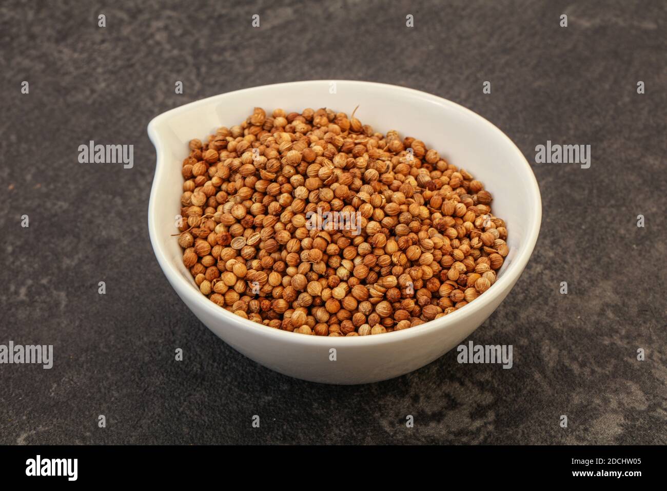 Dry Coriander seeds in the bowl Stock Photo - Alamy
