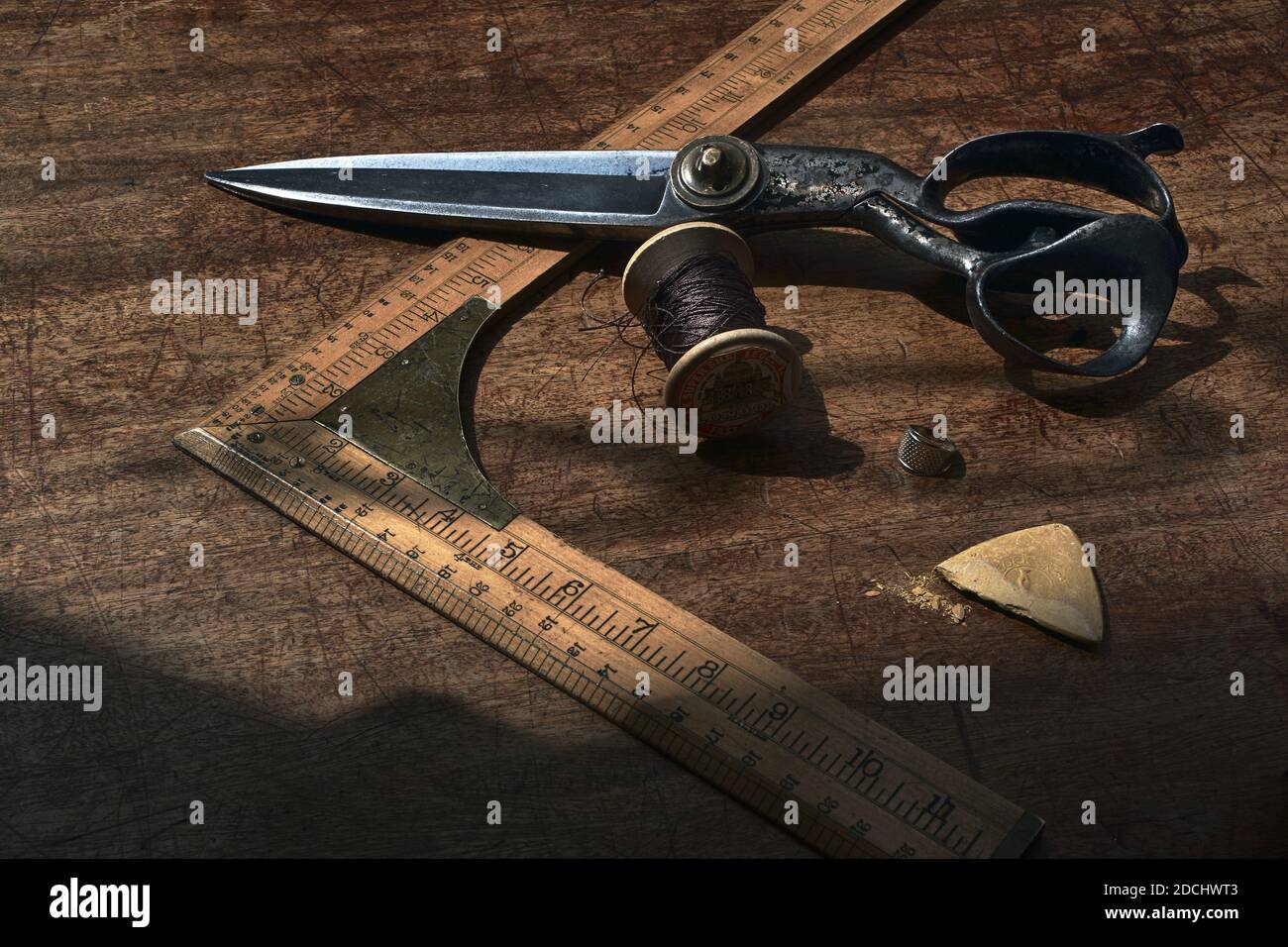 vintage ruler and scissors lying on wooden table at Poole & Co , Savile ...
