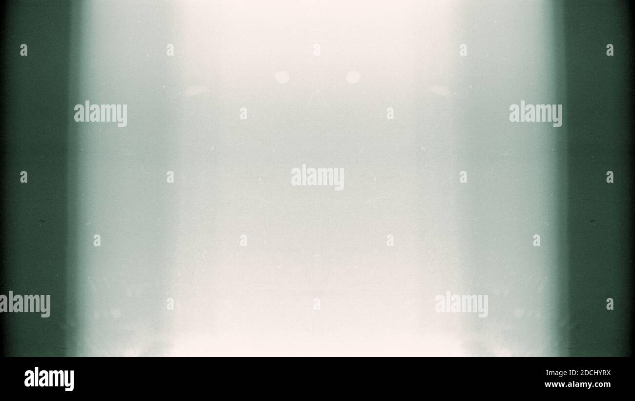 Noisy film frame with heavy scratches, dust and fingerprint. Abstract ...