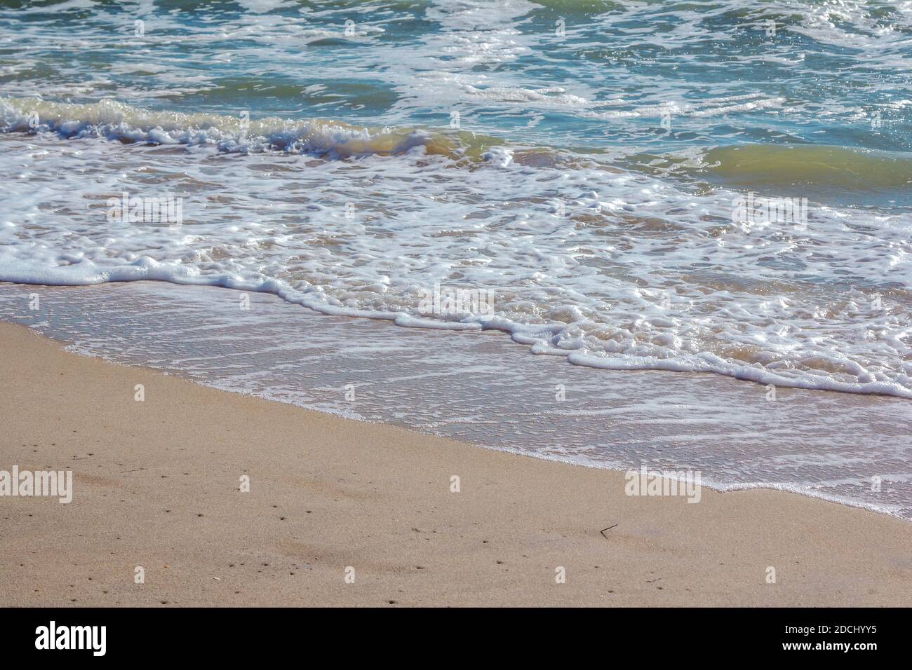 Landscape with stormy sea - clear water and foam - wave, covering sandy ...