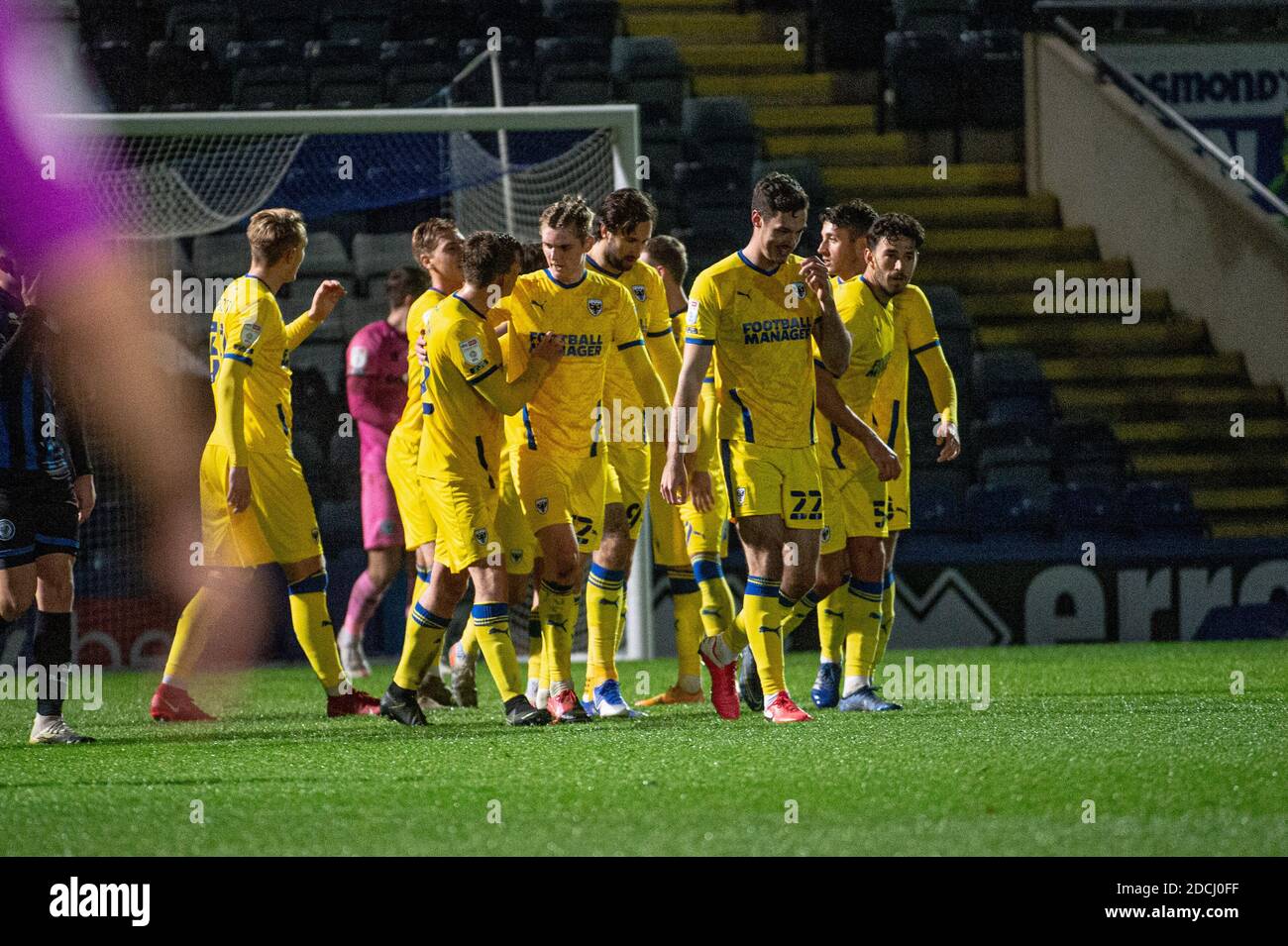 ROCHDALE, ENGLAND. NOVEMBER 21ST Ethan Chislett of AFC Wimbledon scores ...