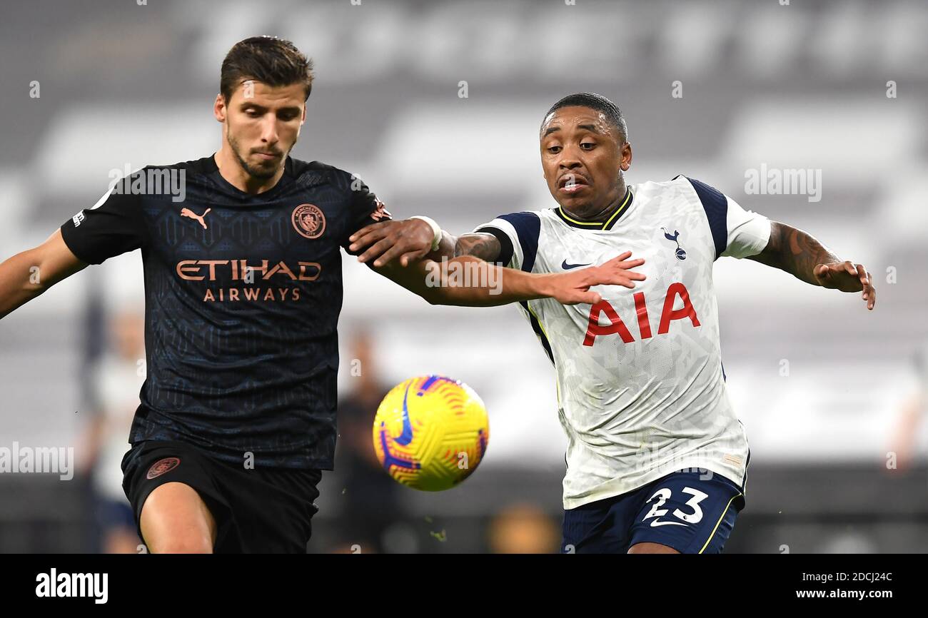 Manchester City's Ruben Dias (left) and Tottenham Hotspur's Steven Bergwijn battle for the ball ...