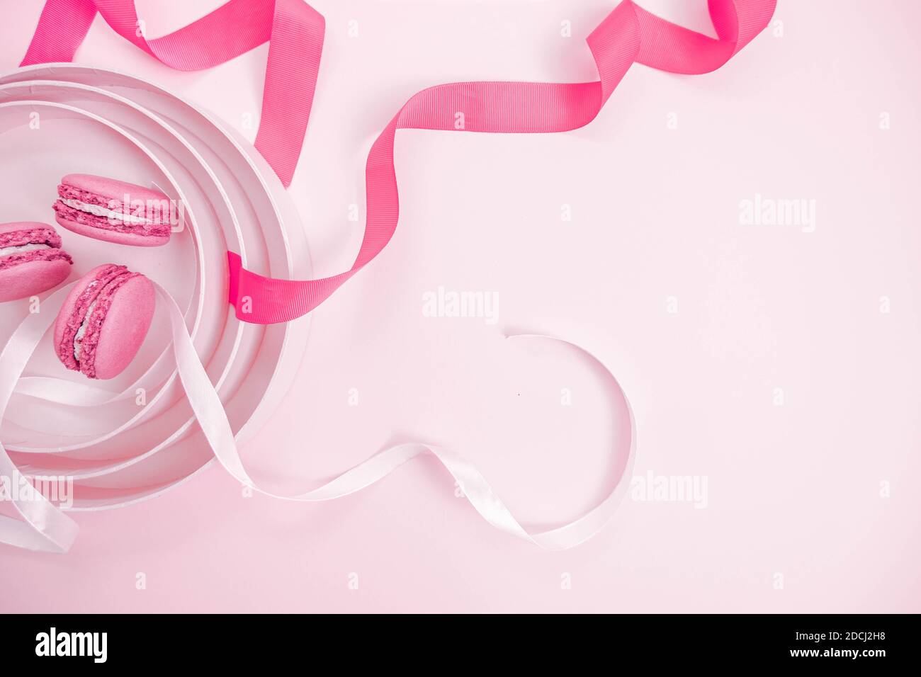 Valentine's Day. Pink background with macaroons Stock Photo - Alamy
