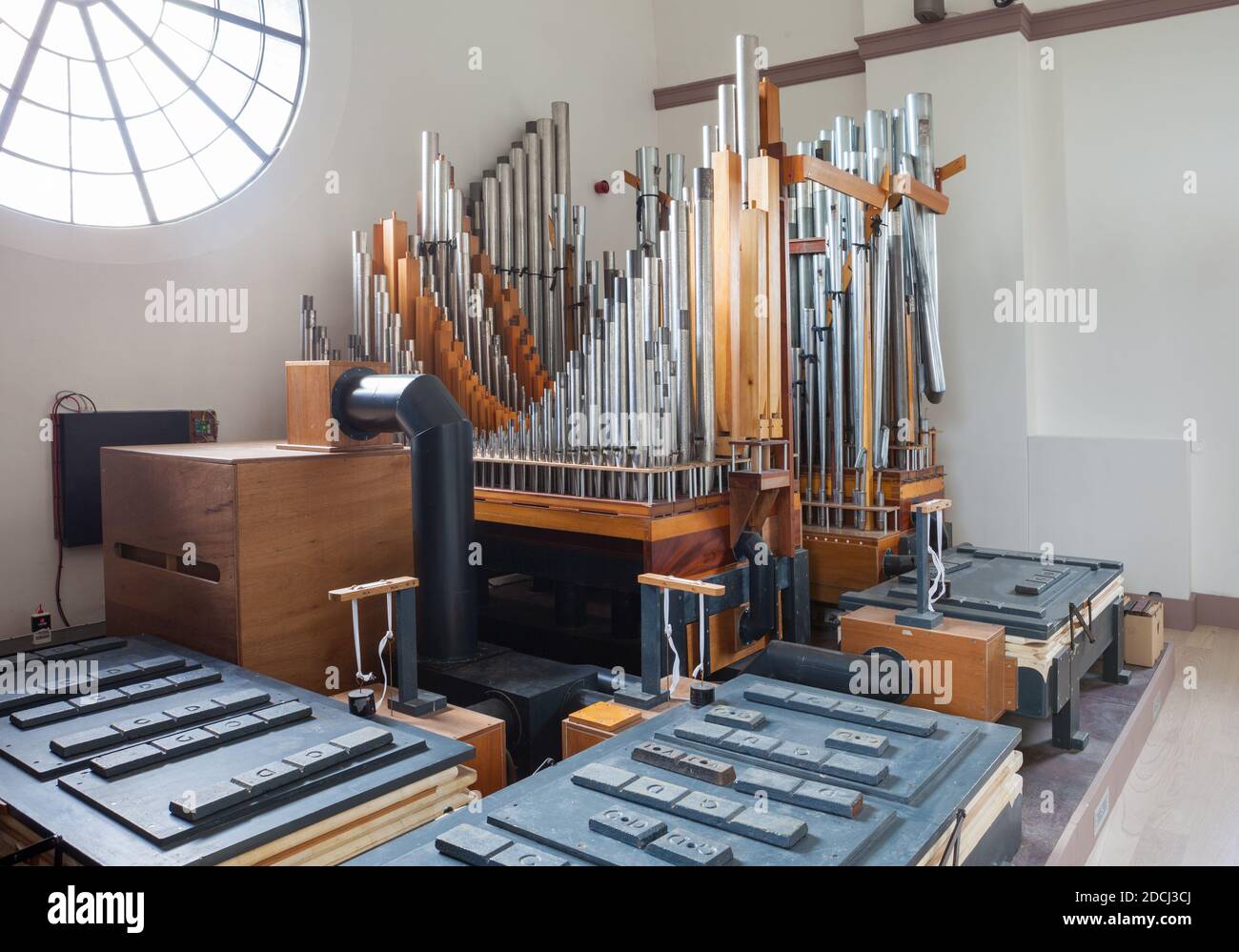 Exposed pipes and mechanism of the pipe organ in the church of the ...