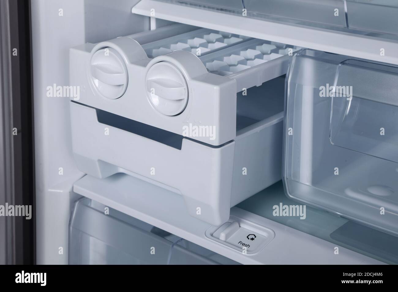 Closeup view of the home refrigerator ice maker Stock Photo - Alamy