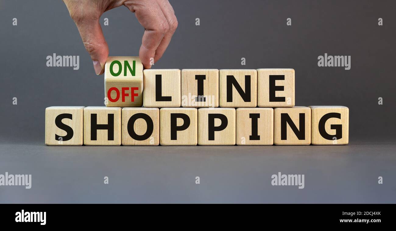 Time to online shopping. Male hand turns the cube and changes the ...