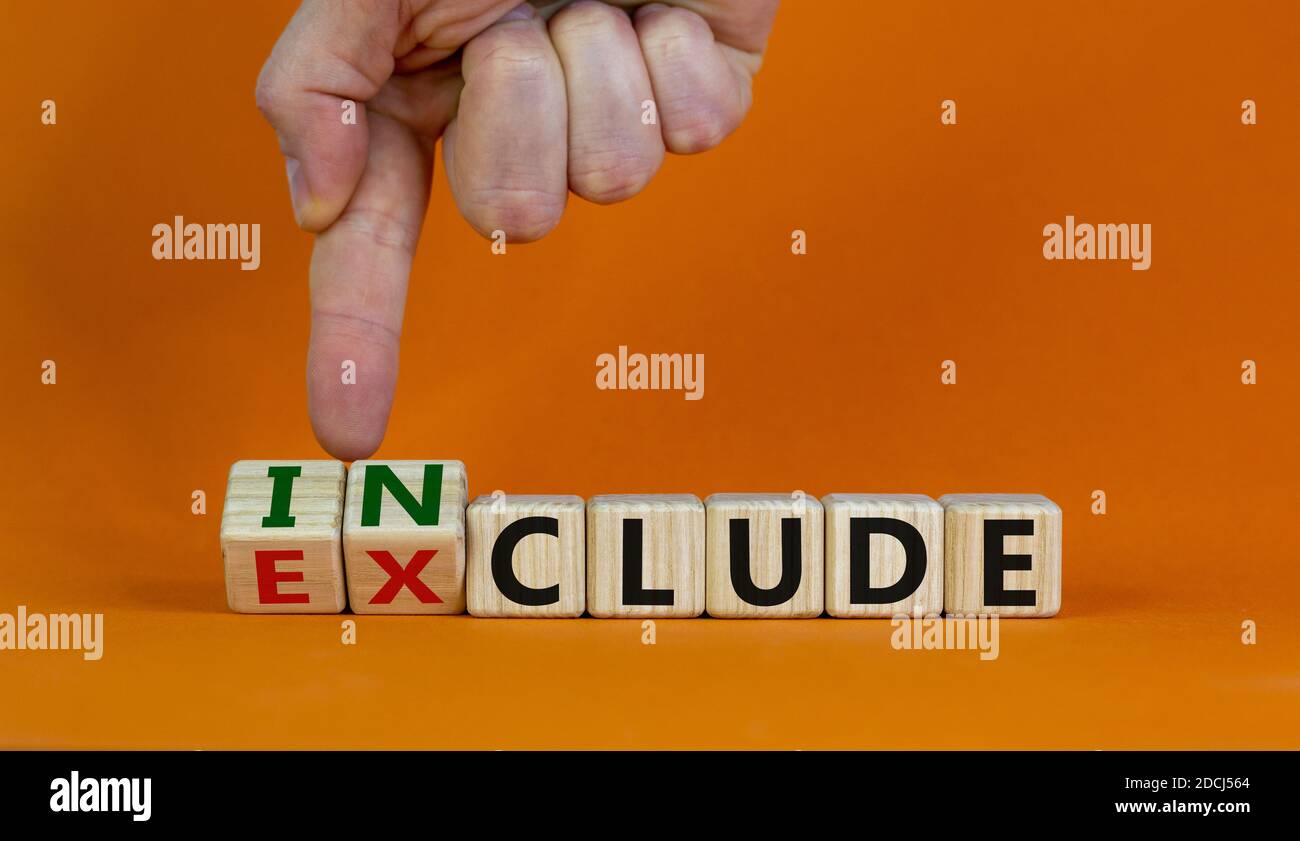 Symbol for a better inclusion. Male hand turns wooden cubes and changes ...