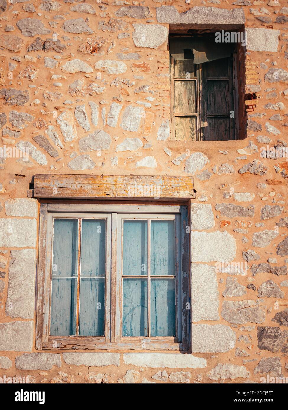 Vintage wooden windows on stone house, soft light Stock Photo - Alamy