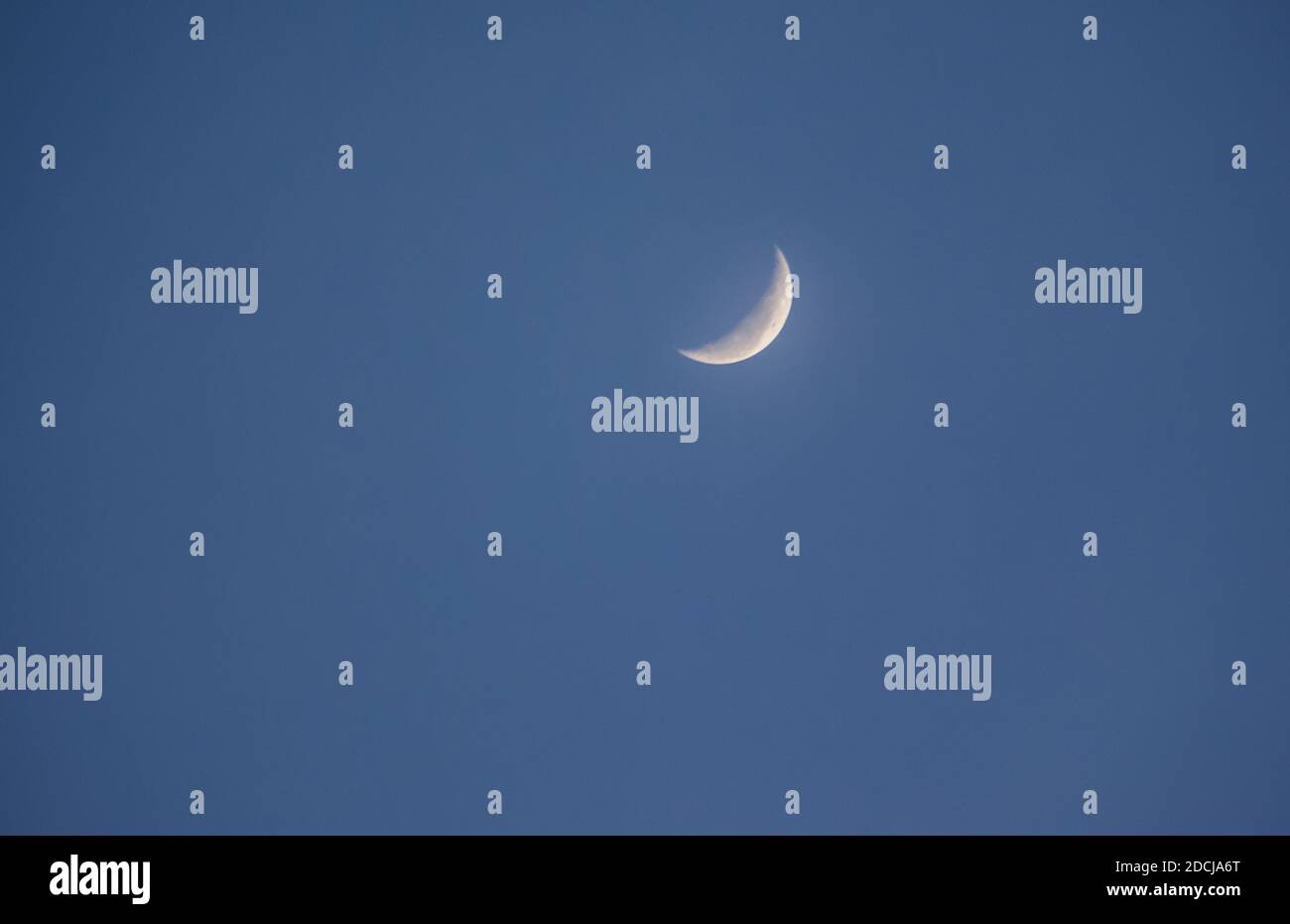 A beautiful crescent moon against a dark night sky Stock Photo - Alamy