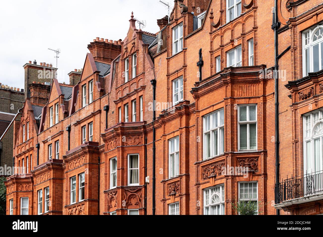 A row of red brick gables on Pont Street in the Royal Borough of ...