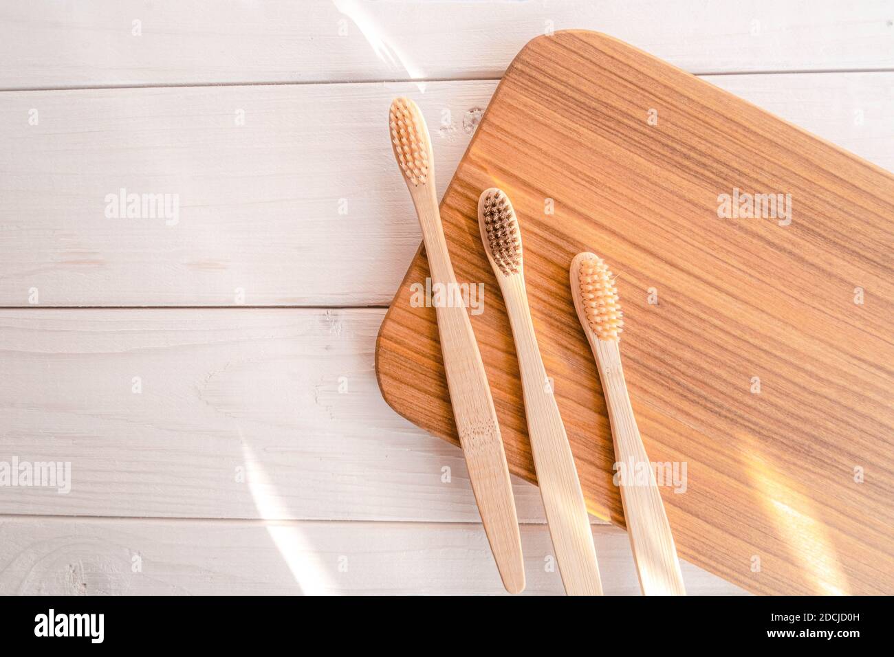 Zero waste bamboo toothbrush on eco wooden white Stock Photo - Alamy