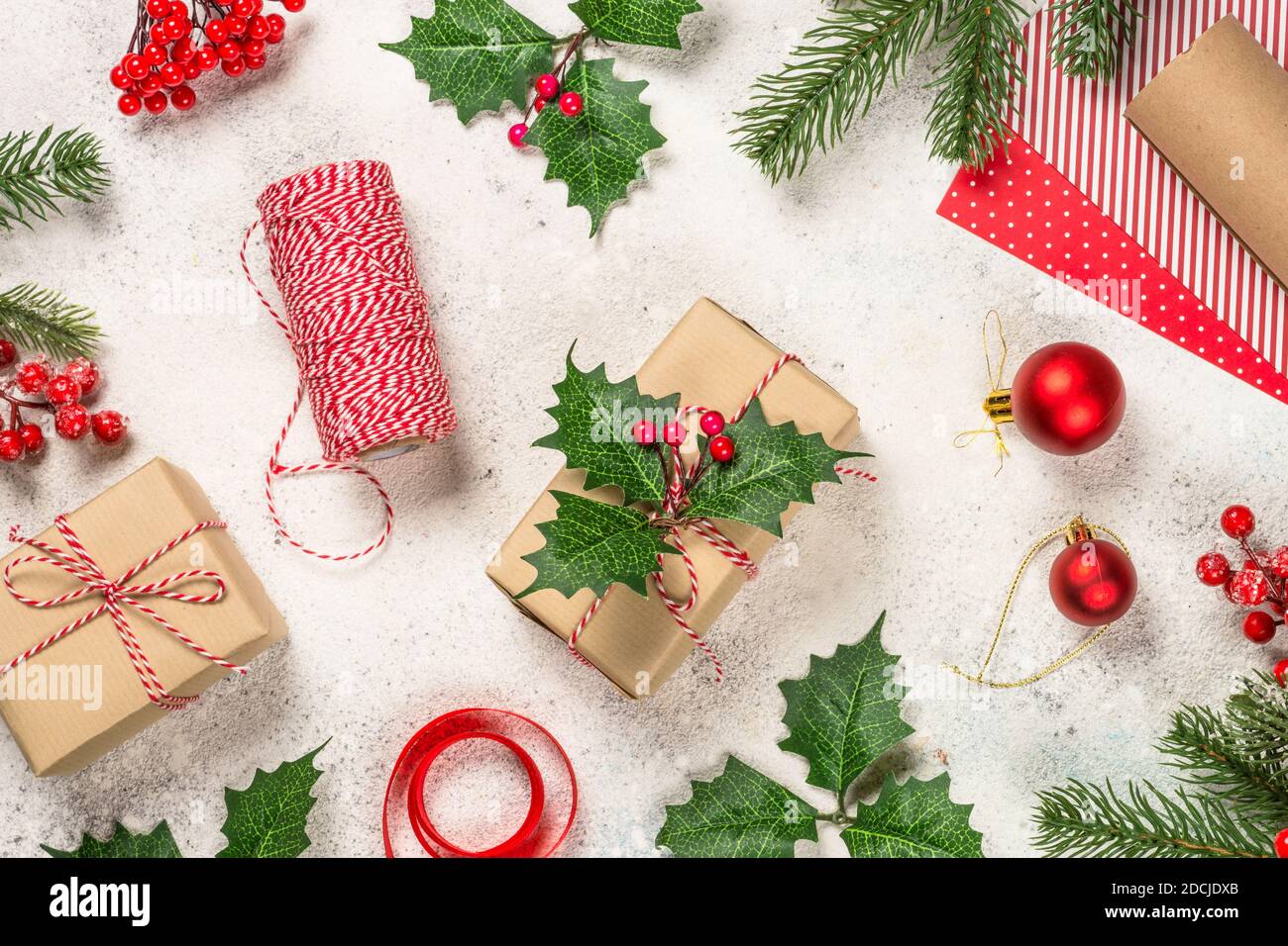 Wrapping christmas presents on white Stock Photo - Alamy