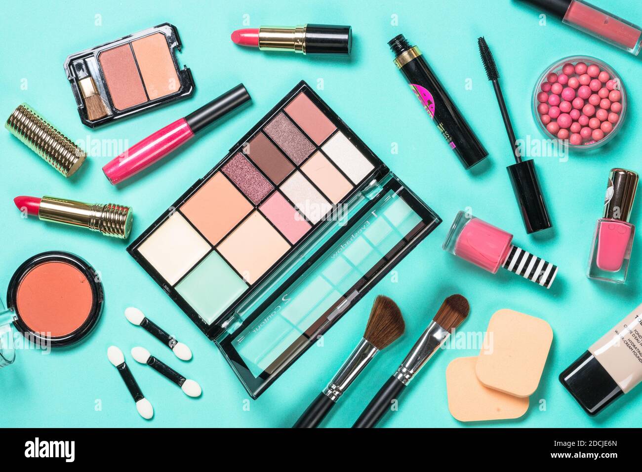 Makeup professional cosmetics on mint background Stock Photo - Alamy