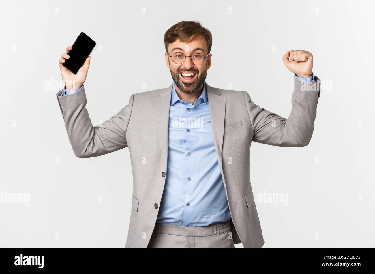 Image of successful businessman in grey suit and glasses, holding ...