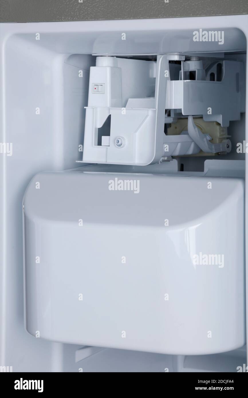 Closeup view of the home refrigerator ice maker Stock Photo - Alamy