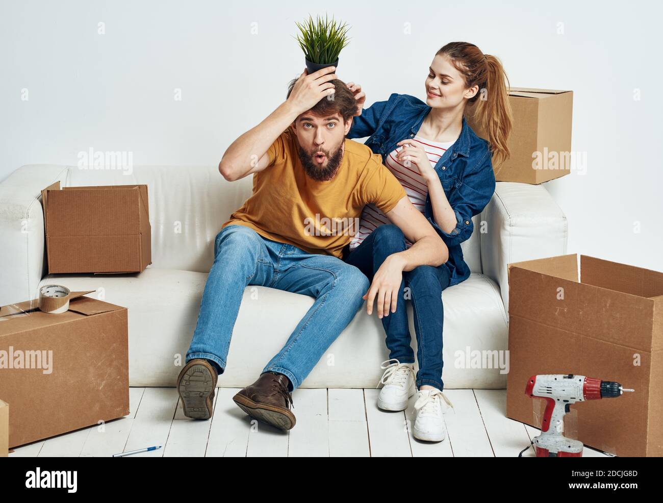 Married couple moving boxes with things lifestyle emotions interior ...