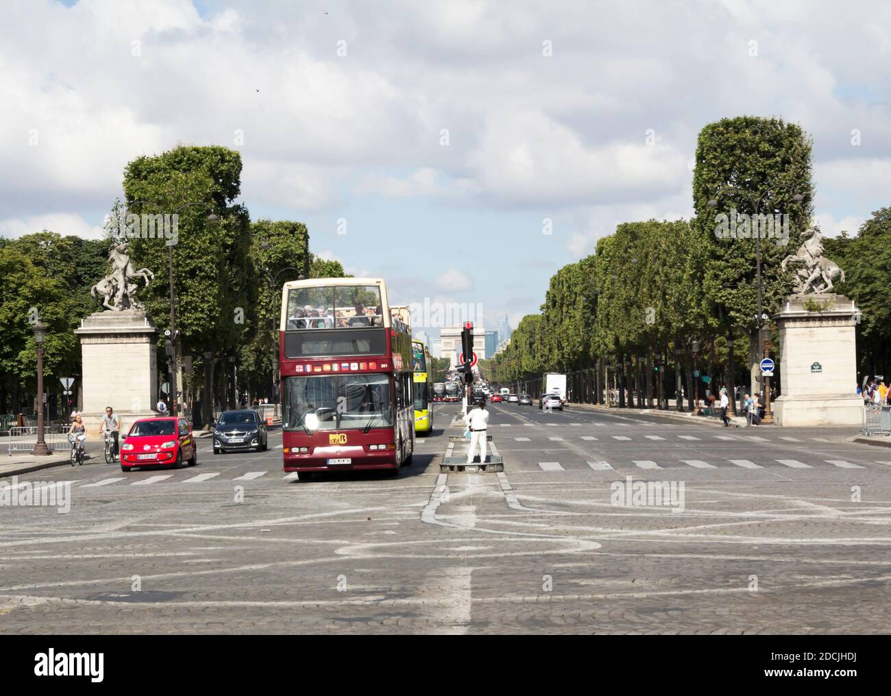 PARIS 2016: Tourist bus in Parisian street and Champs Elysees street in ...