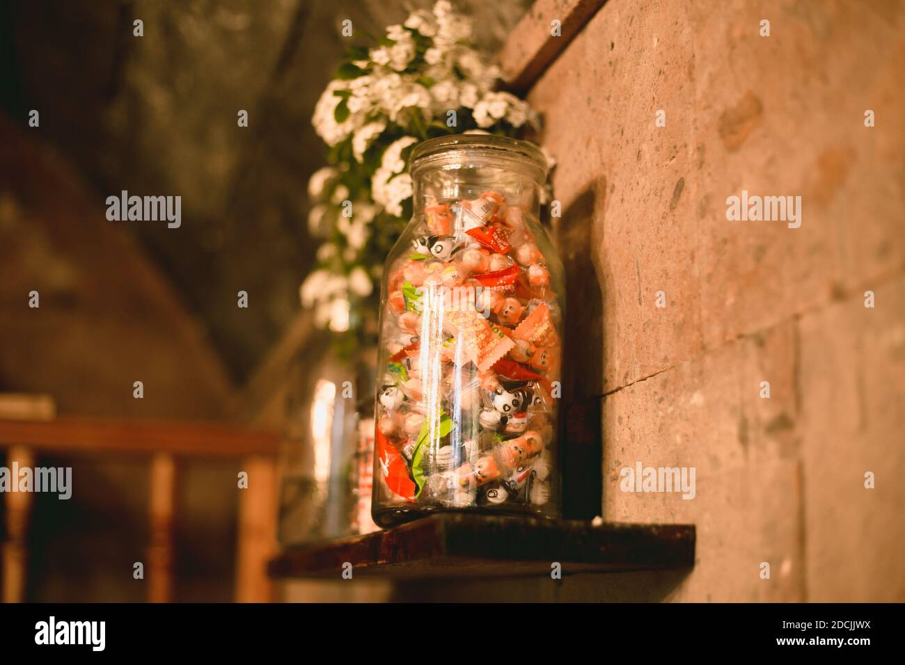 Big glass bottle full of sweets and candies Stock Photo - Alamy