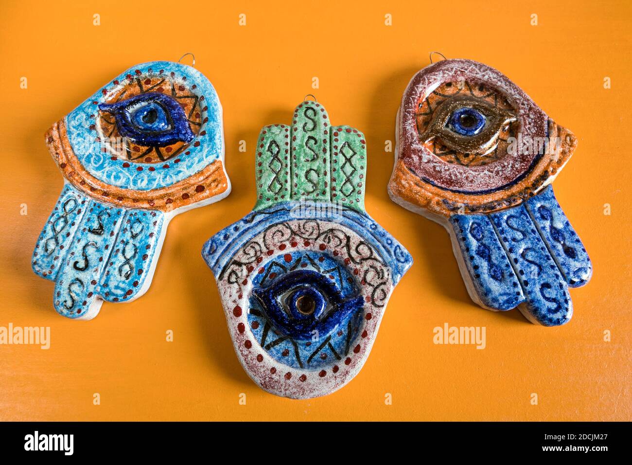 Cairo, November 10. handmade colorful decorated pottery three hands ...