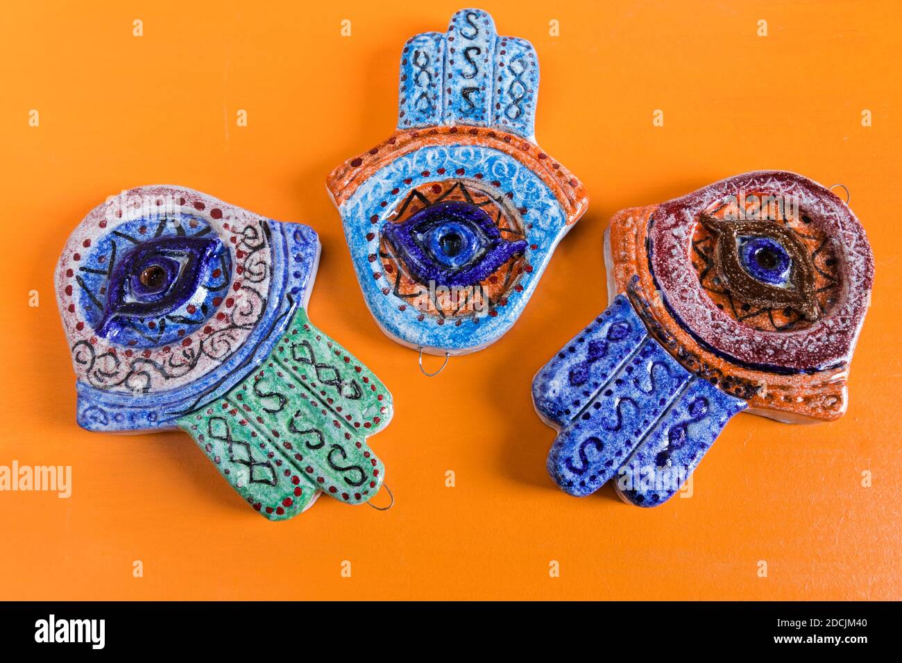 Cairo, November 10. handmade colorful decorated pottery three hands ...