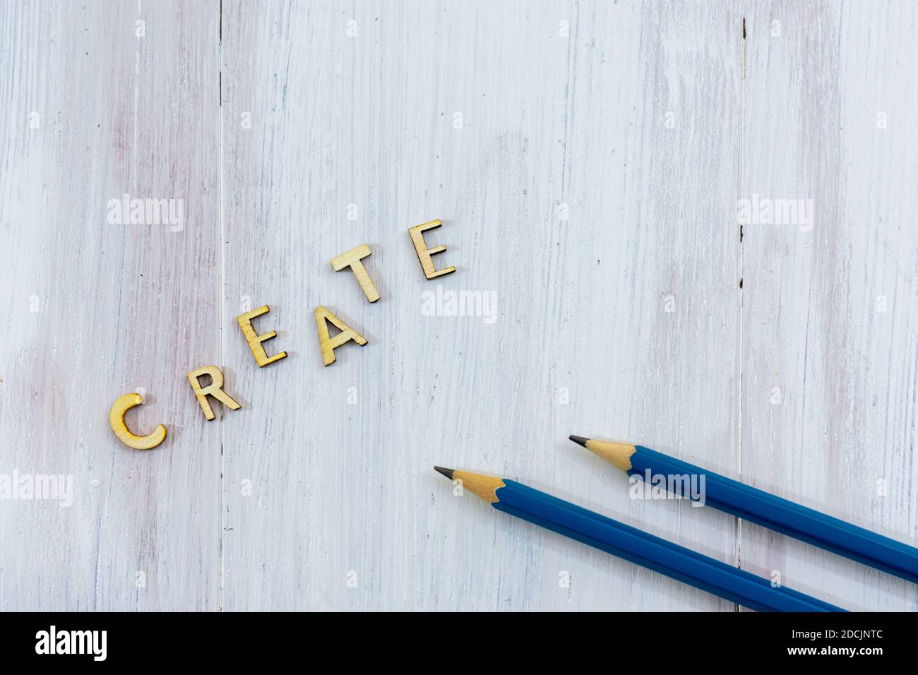 Top view of wooden letters word create with pencils, over wooden ...