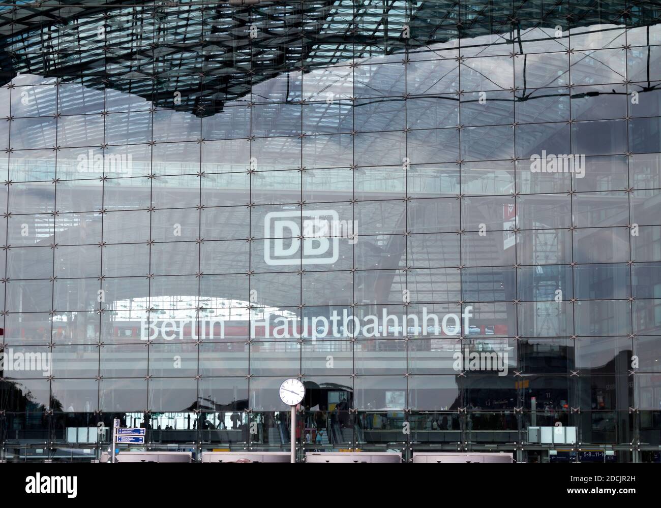 German railway logo "DB" (Deutsche Bahn) on glass facade of Berlin main ...