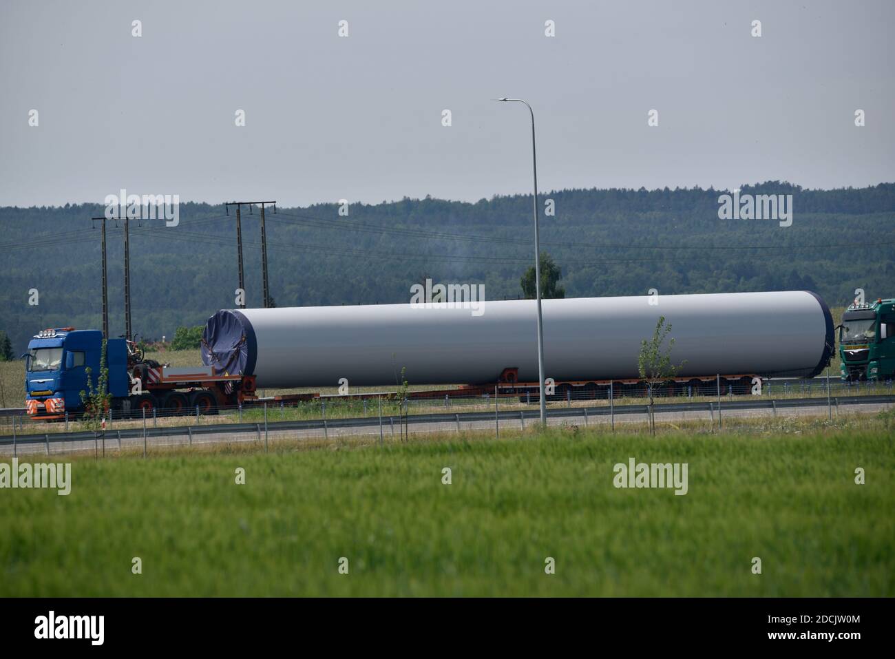 transport of steel wind turbine mast components by trucks Stock Photo ...