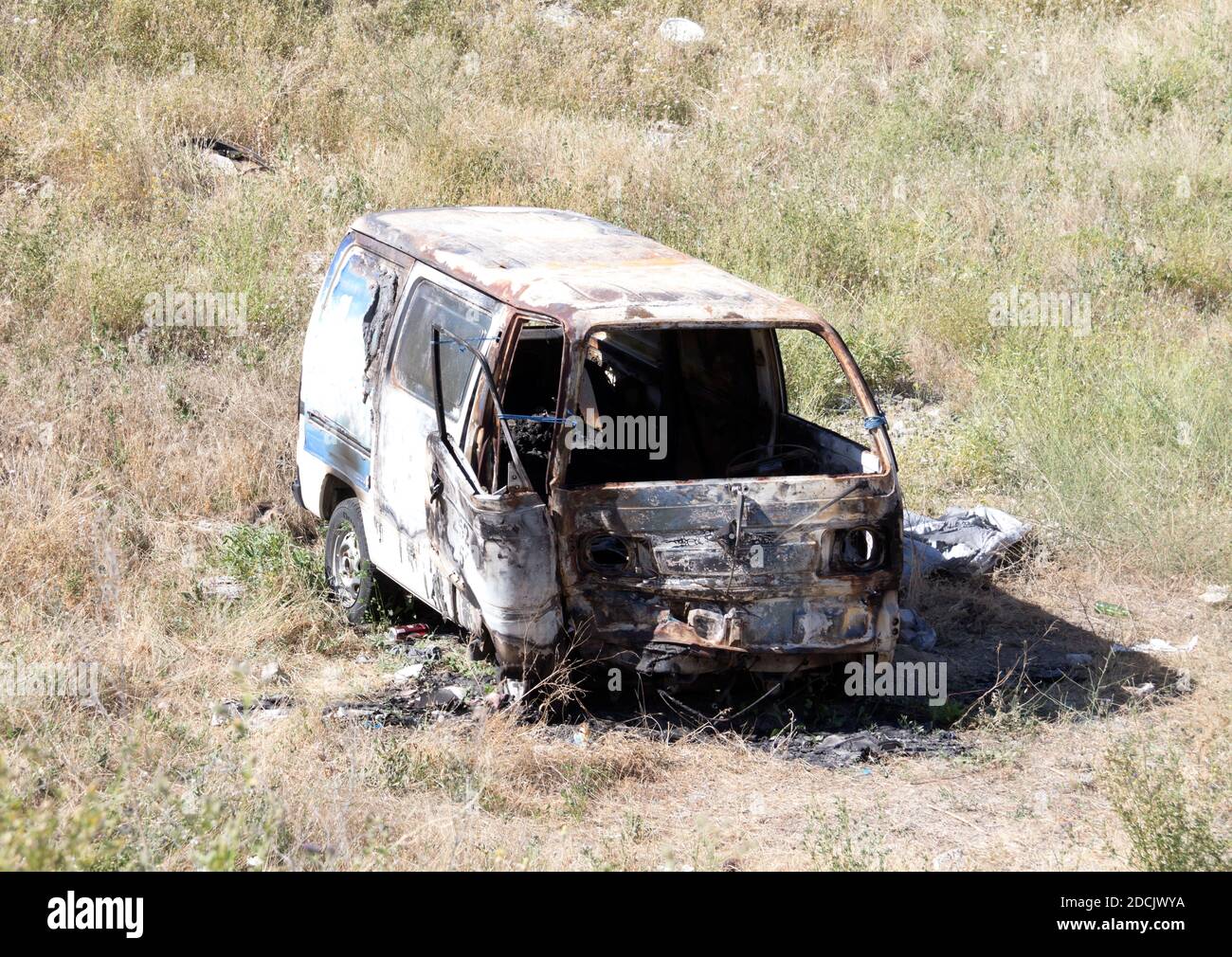 Burnt out car wreck Stock Photo - Alamy