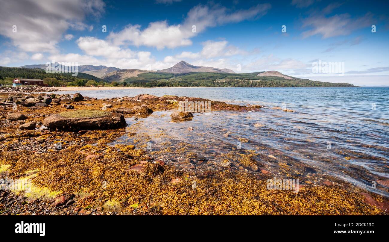 Goatfell mountain provides the backdrop for Brodick Bay on the Isle of ...