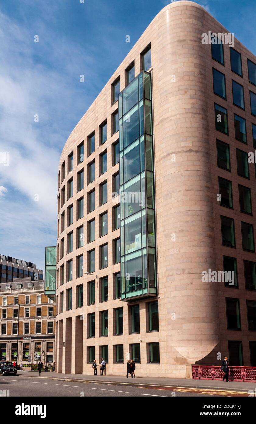 London, England, UK - April 9, 2010: Pedestrians walk past the modern ...