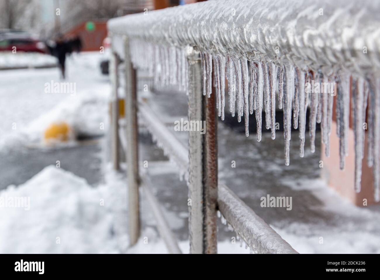 Beautiful icicles hung from the chrome railings in the city near the ...