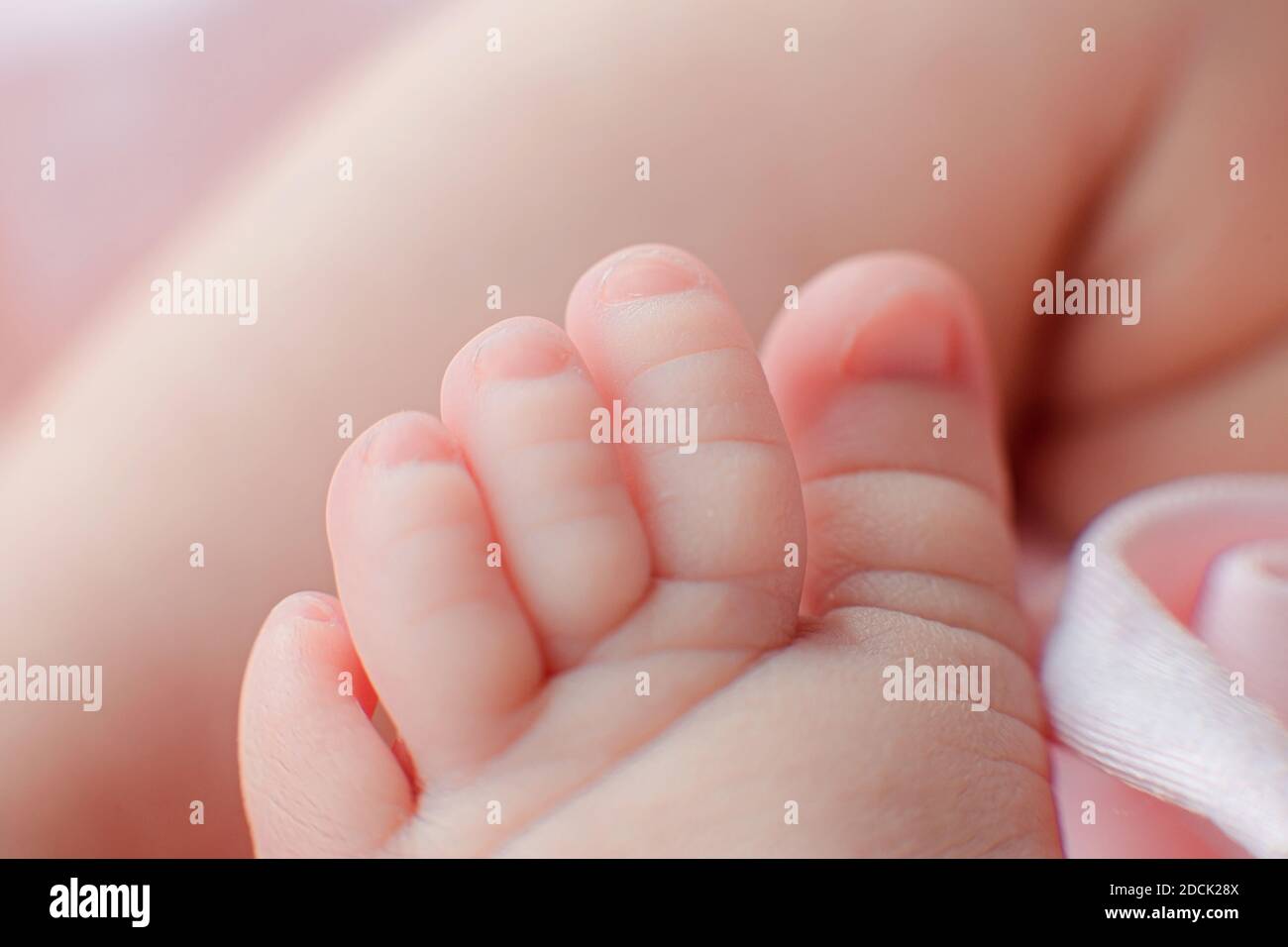 Caucasian Newborn baby foot closeup macro detail shot. child portrait ...