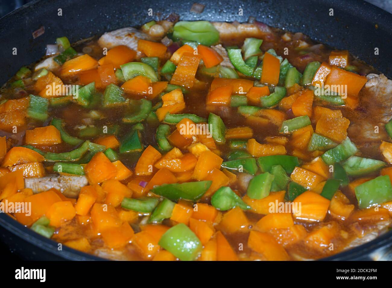A closeup of a chicken and bell peppers dish Stock Photo - Alamy