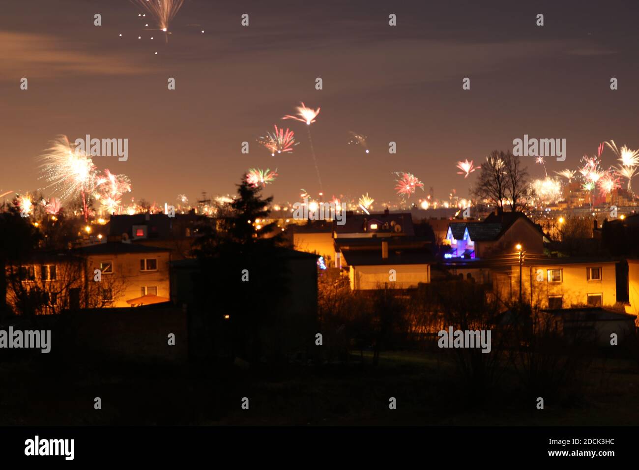 View of an panorama of exploding fireworks over a city in New Year ...