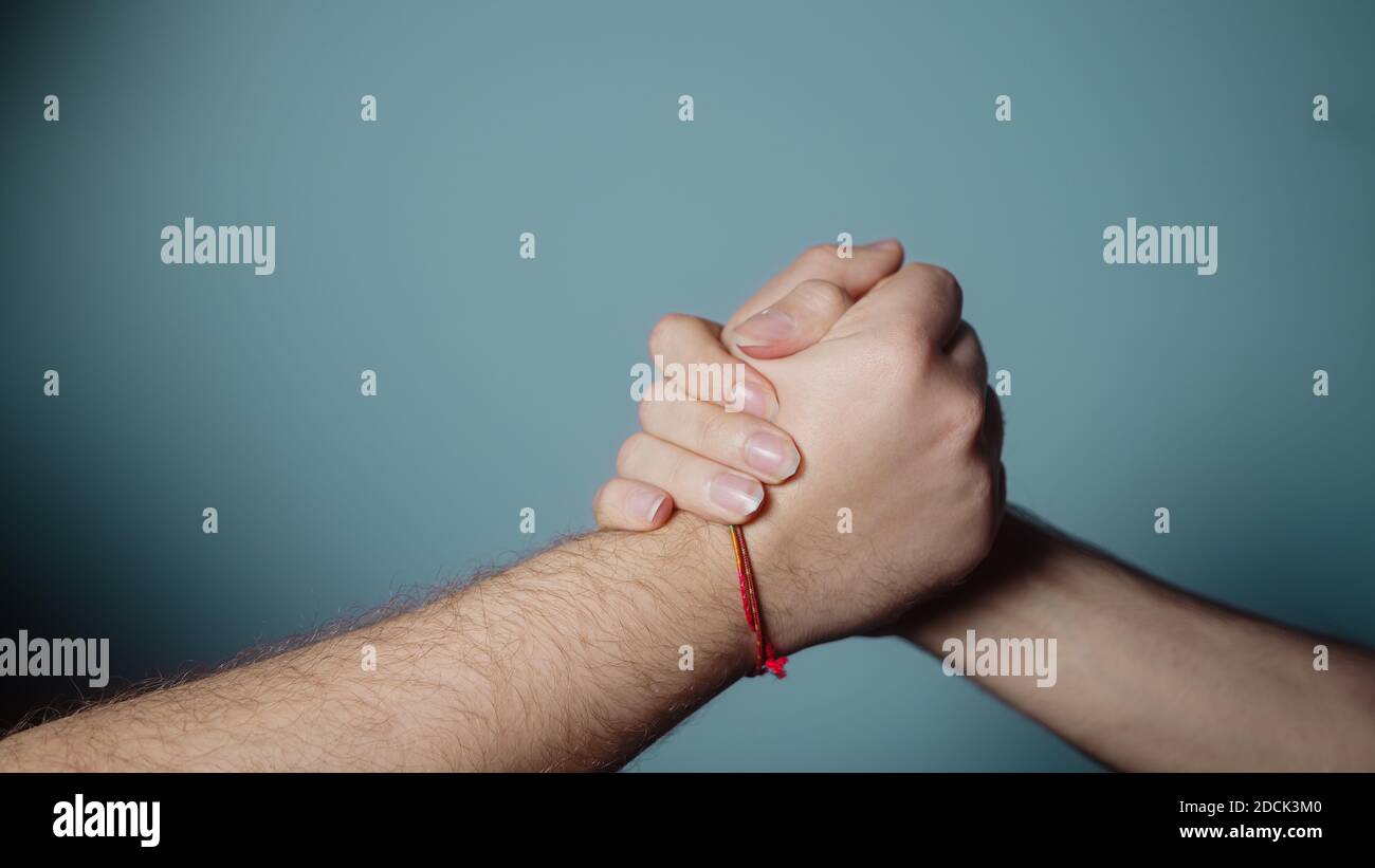 Cyan studio is placed one two man shake hands in the background ...