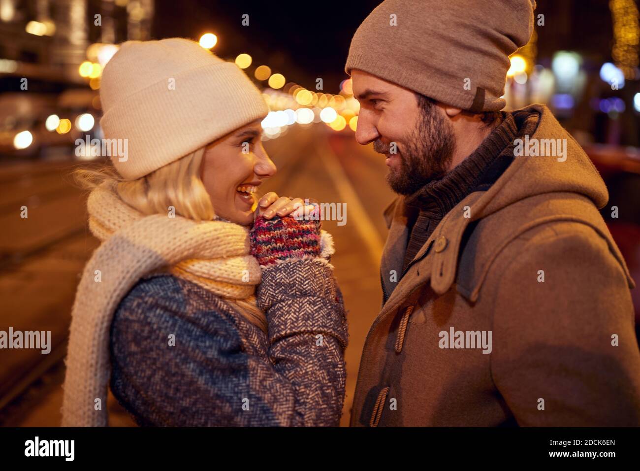 A young couple in love having romantic moments in the walk of the city ...
