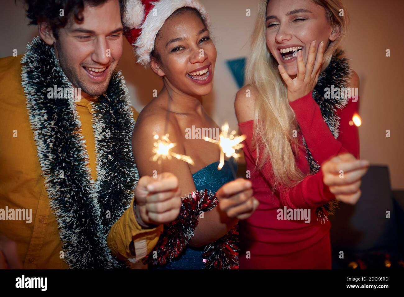 A group of cheerful friends with sprinkles posing for a photo in happy ...