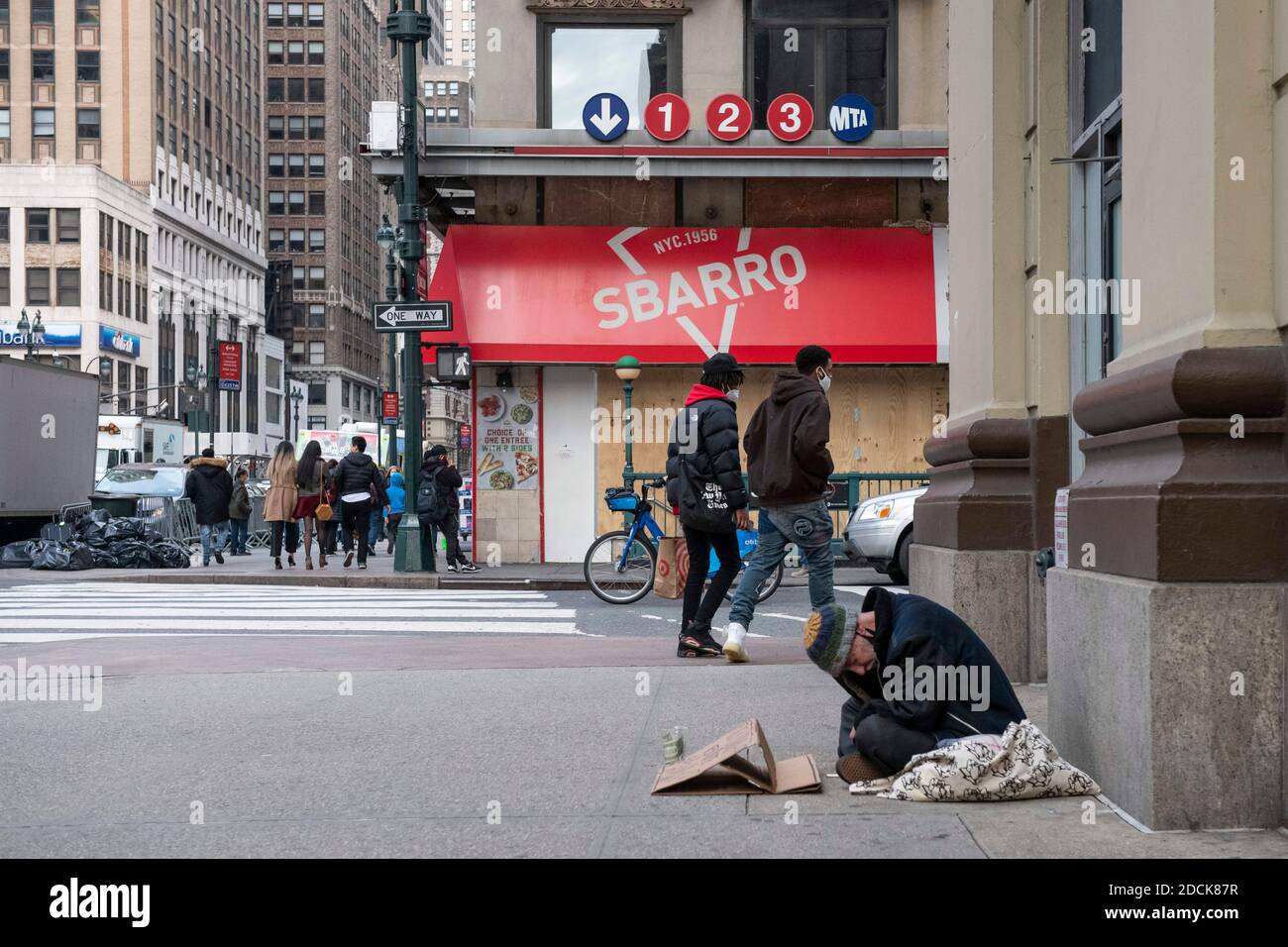 Manhattan, New York, USA. 21st Nov, 2020. A homeless man sits on the ...