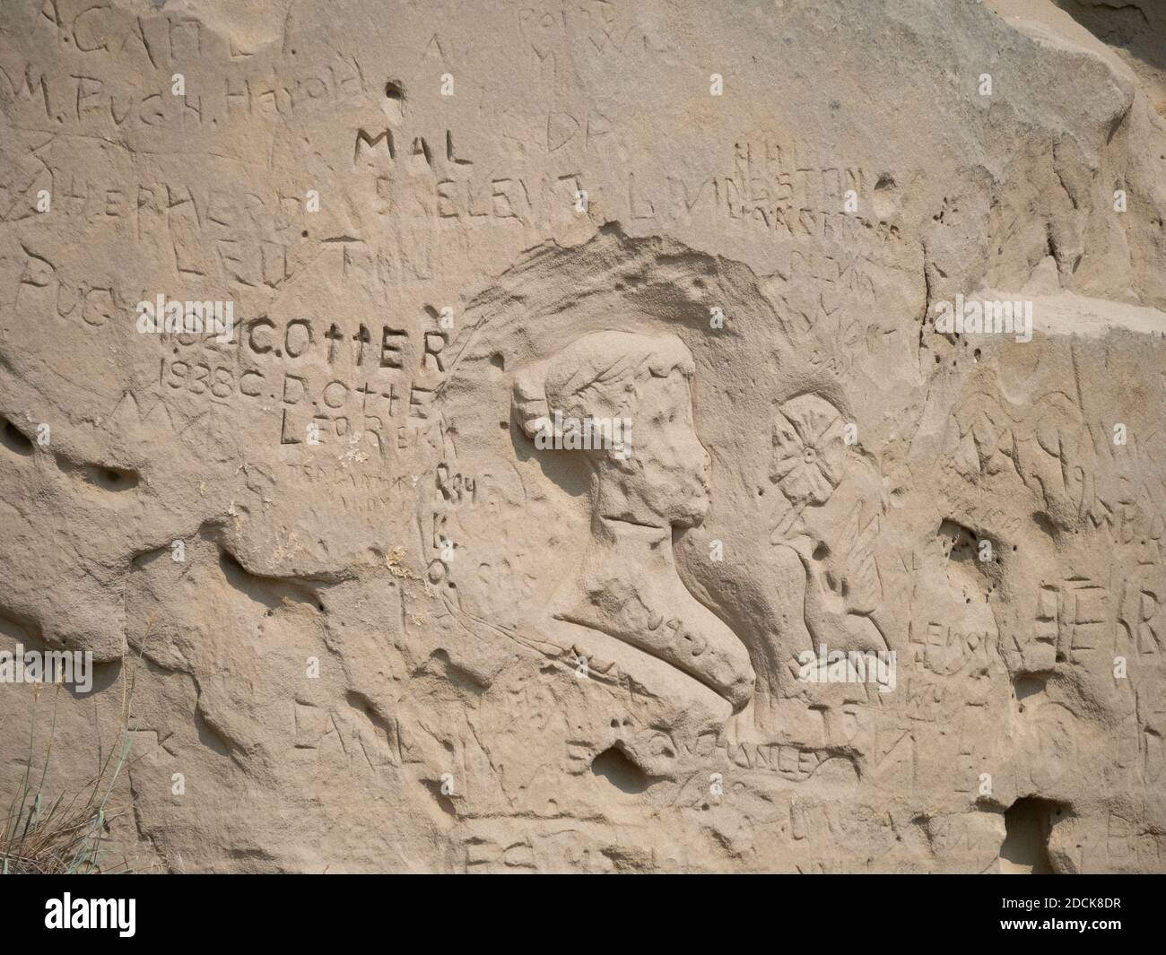 Woman's portrait and names carved into stone at Medicine Rocks State ...
