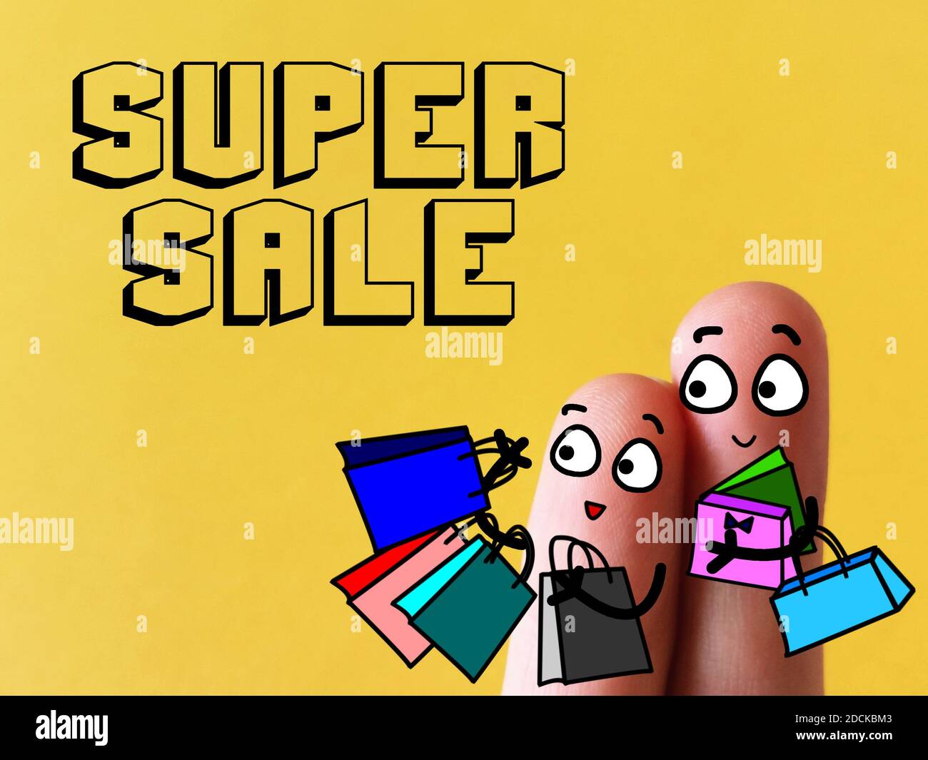 Two fingers are decorated as two person. They are enjoying super sale ...