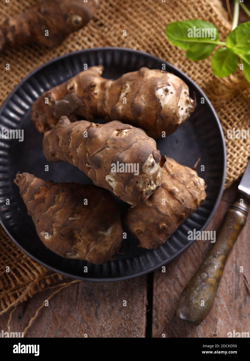 organic Jerusalem artichoke vegetable on a wooden table Stock Photo - Alamy