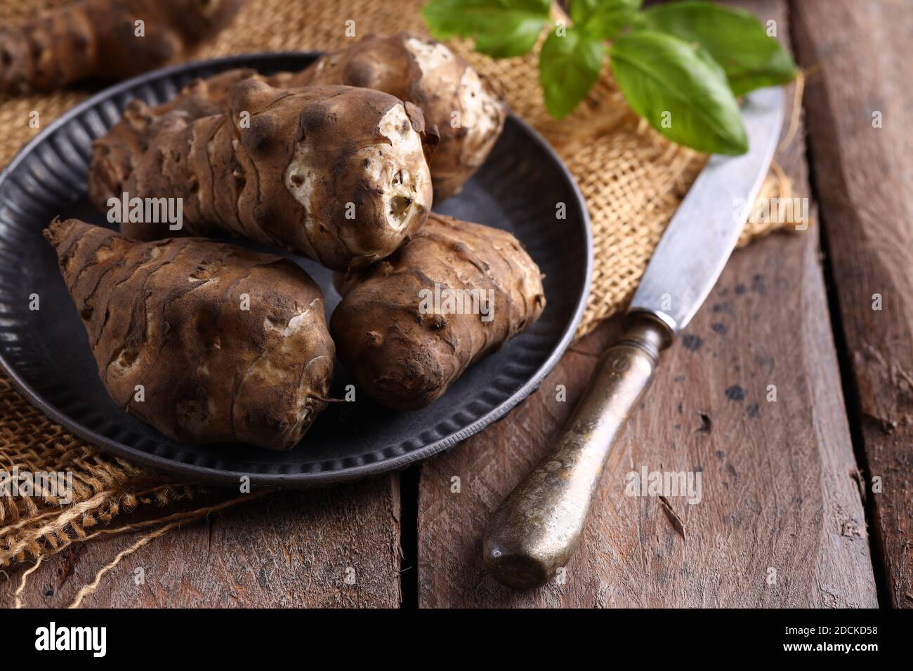 organic Jerusalem artichoke vegetable on a wooden table Stock Photo - Alamy