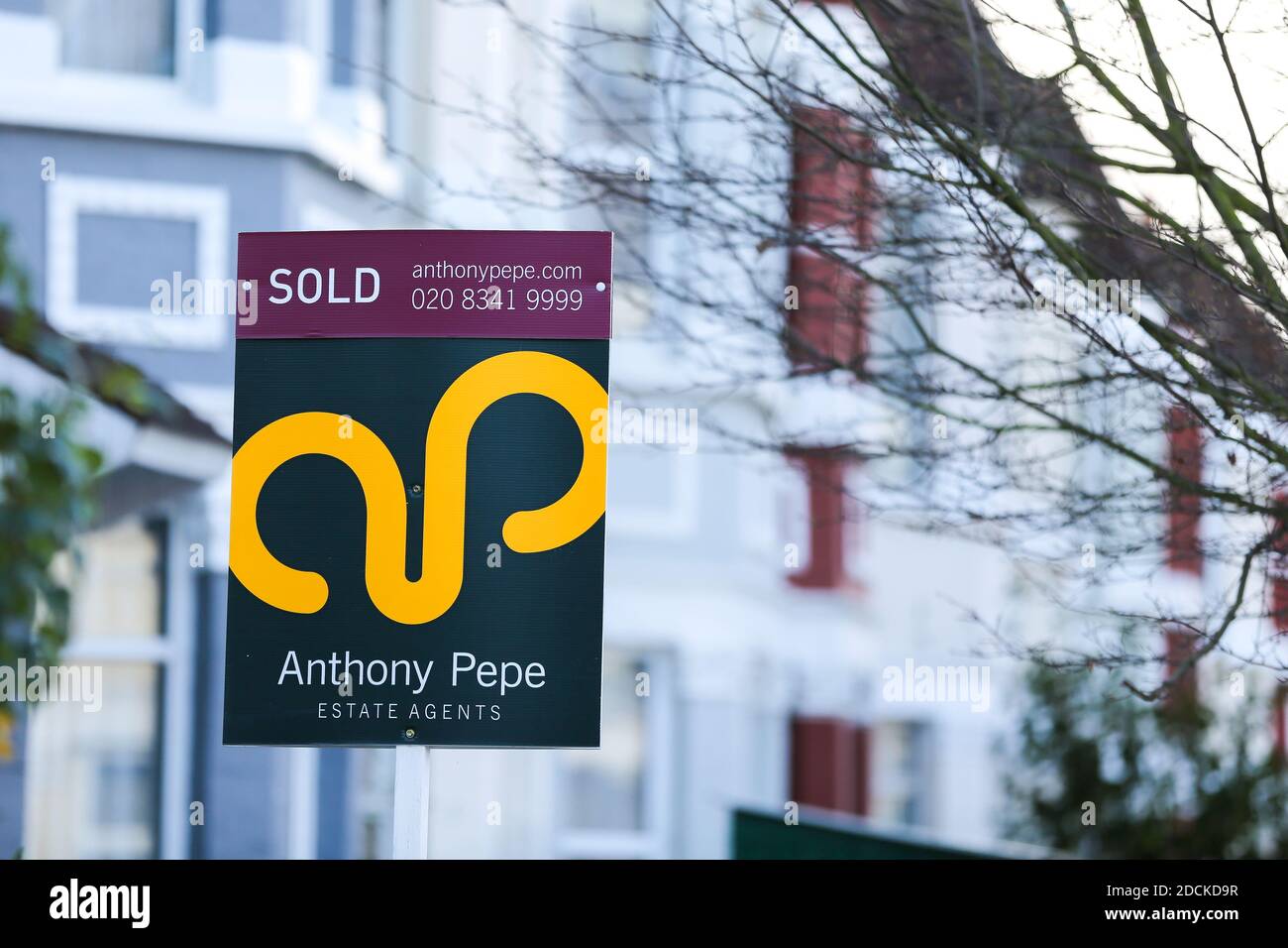 A "Sold" estate agent board sign erected outside a property in London ...